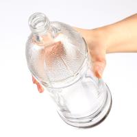 China Round Cylinder Glass Beverage Bottle with Customized Logo and Sealing Cap Brush for sale
