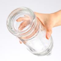 China Round Cylinder Glass Beverage Bottle with Customized Logo and Sealing Cap Brush for sale