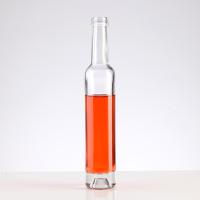 China Clear 750ml Tequila Empty Wine Bottle with Lid and Hot Stamping Surface Handling Tesla for sale