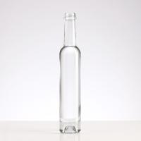 China Clear 750ml Tequila Empty Wine Bottle with Lid and Hot Stamping Surface Handling Tesla for sale