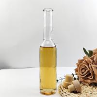 China Acceptable Customer's Logo Clear Color Long Neck 50ml 100ml Glass Oil Bottle with Cork Cap for sale