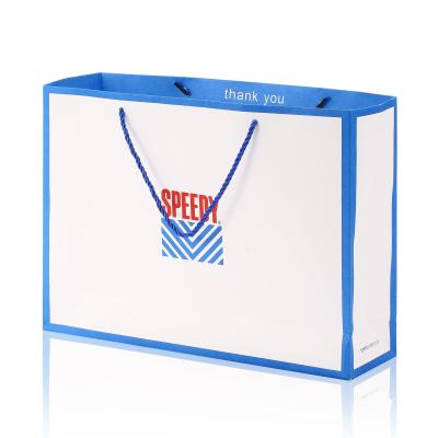 China Gloss Art Paper 250GSM Double Colors Printing Custom Design Shopping Paper Bag with Blue Color Handle for sale