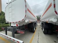 China SINOTRUK TX Model 6X4 25CBM Oil Tank Truck 10Wheels 336Hp White Two Warning Lights for sale