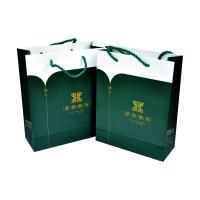 China Customized Flat Handle Paper Bag , Spot UV Finishing Brown Paper Packaging Bags for sale