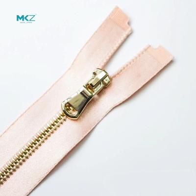 China Ribbon Pink Zipper Gold Plated Zipper Teeth for Coat  Metal Zipper for sale