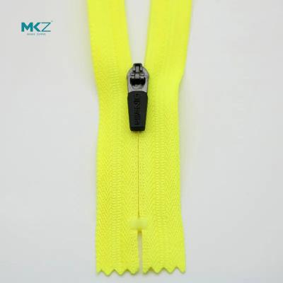 China Fluorescent Green Bag Open Ended Invisible Zip With Locking Glue Pull Head for sale