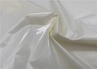 China GRS 100% Recycled Bright waterproof nylon fabric PU Coating Pet Winter Coat Fabric for sale