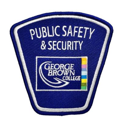 China Custom Embroidery Patch Iron On Merrow Border Twill Felt Polyester Logo Patch 2x3 Inch for sale