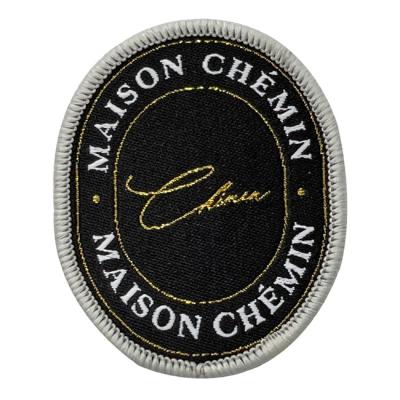 China Custom Woven Patches Black Fabric Sew On Patch for Letterman Jackets 100 PCS MOQ for sale
