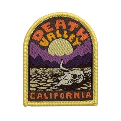 China Custom 12 cm Iron On Woven Patches Merrowed Border for Clothing Custom Logo for sale