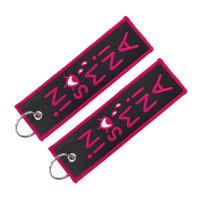 China Overlock Border Embroidered Key Chains Promotional Jet Tag Keychains for sale