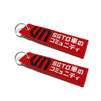China Custom Flight Tag Embroidered Key Chains PMS Color With Metal Ring for sale