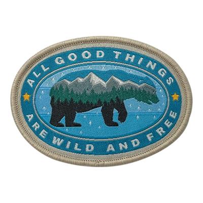 China Custom Velcro Backing Animal Iron On Woven Patch Polyester Pantone 12C Merrow Border for sale