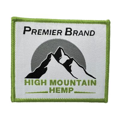 China Custom Personalized Hot Melt Iron On Woven Patch Merrow Border For Wristband for sale