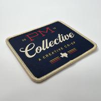 China Custom Iron On Woven Patch 12 Colors Eco Friendly Washable Clothing Garment Patch for sale