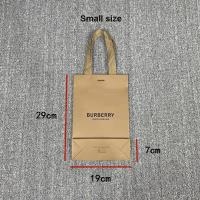 China 200pcs To 500pcs Gold Stamping Clothing Paper Bags Ribbon Handles Kraft Shopping Bags for sale