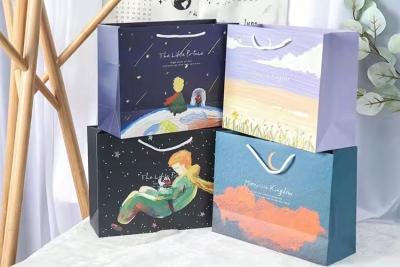 China Little Prince Print Recycled Paper Merchandise Bags 33x25x12cm for sale