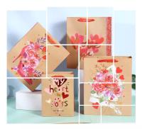 China Ribbon Handle Christmas Kraft Paper Bags Decorating Paper Bag For Valentine'S Day for sale
