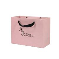 China Glossy Lamination Shoes Clothing Paper Bags 250gam Coated Pink Kraft Bags for sale