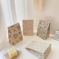 China Small Floral Folded Handle Present Paper Bags 30gsm-160gsm Wedding Paper Gift Bag for sale