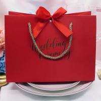 China Offset Printing Patch Handle Kraft Paper Bags Paper Welcome Bags For Wedding Guests for sale