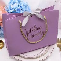 China Offset Printing Patch Handle Kraft Paper Bags Paper Welcome Bags For Wedding Guests for sale