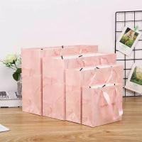 China Customized Logo 180gsm-500gsm Boutique Paper Bag With Handles for sale