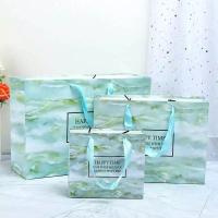 China Customized Logo 180gsm-500gsm Boutique Paper Bag With Handles for sale