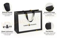 China Tear Resistant 80gsm-120gsm Kids Clothing Paper Bags Custom Logo for sale