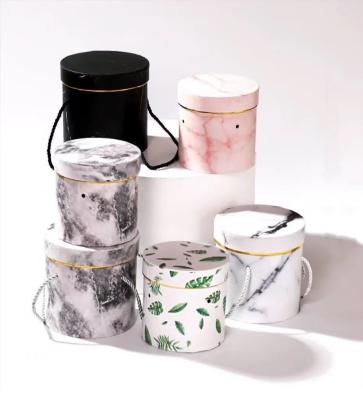 China Green Leaf Veins Marbling Round Flower Gift Box Cylinder Rose Box With Handle for sale