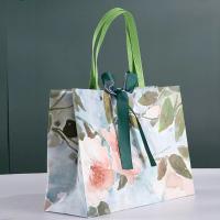 China Logo Printed Cosmetic 230gsm Present Paper Bags Twisted Rope Handle Paper Bags for sale