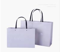 China ODM 180gsm To 250gsm Present Paper Bags Clothing Wedding Favor Bags With Handles for sale