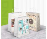 China 27cm*20.3cm*11cm Gravure Printing Cosmetic Paper Bags With Button for sale