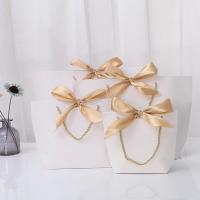 China Stamping Logo Light Green Cosmetic Shopping Bag Bow Tie Ribbon White Gift Bag for sale