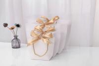 China Stamping Logo Light Green Cosmetic Shopping Bag Bow Tie Ribbon White Gift Bag for sale