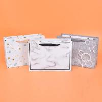 China 20*28cm 26*35cm 32*43cm Cosmetic Paper Bags With Ribbon Handles for sale