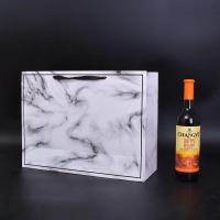 China 20*28cm 26*35cm 32*43cm Cosmetic Paper Bags With Ribbon Handles for sale