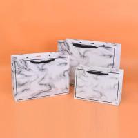 China 20*28cm 26*35cm 32*43cm Cosmetic Paper Bags With Ribbon Handles for sale