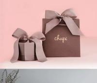 China Apparel Smoky Printed Paper Shopping Bags C2S Artpaper Ribbon Handle Gift Bags for sale