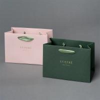 China Apparel Smoky Printed Paper Shopping Bags C2S Artpaper Ribbon Handle Gift Bags for sale