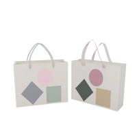 China 128gsm-350gsm Art Paper Shopping Bag Simple Strokes Printing Brown Paper Grocery Bags for sale