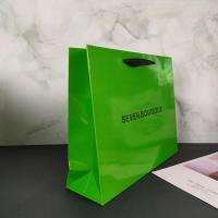China Gold Logo 26x9x33cm Avocado Green Apparel Paper Bag With Ribbon Handle for sale