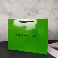 China Gold Logo 26x9x33cm Avocado Green Apparel Paper Bag With Ribbon Handle for sale