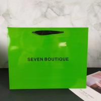 China Gold Logo 26x9x33cm Avocado Green Apparel Paper Bag With Ribbon Handle for sale