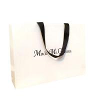 China 175gsm Lotus Color Goose Yellow Garment Paper Bags For Clothing Store for sale