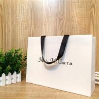 China 175gsm Lotus Color Goose Yellow Garment Paper Bags For Clothing Store for sale