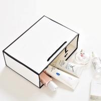 China Cosmetics Three Sections Rope Apparel Paper Bag Ivory Board Boutique Packaging Bags for sale