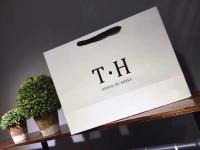 China Cosmetics Three Sections Rope Apparel Paper Bag Ivory Board Boutique Packaging Bags for sale