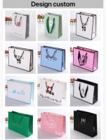 China Cosmetics Three Sections Rope Apparel Paper Bag Ivory Board Boutique Packaging Bags for sale