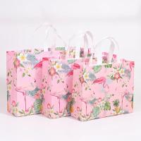 China Logo Printed Gilding Striped Apparel Paper Bag Packaging For Clothes for sale